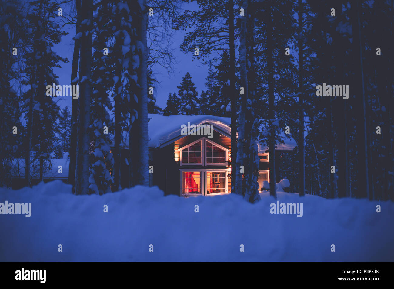 A night view of cozy wooden scandinavian cabin cottage chalet house ...