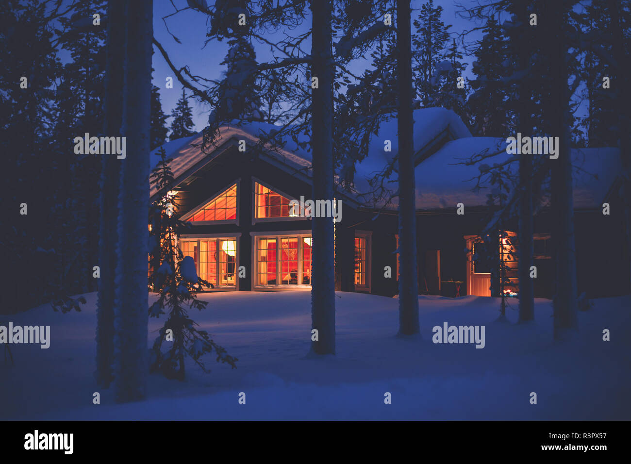 A night view of cozy wooden scandinavian cabin cottage chalet house ...