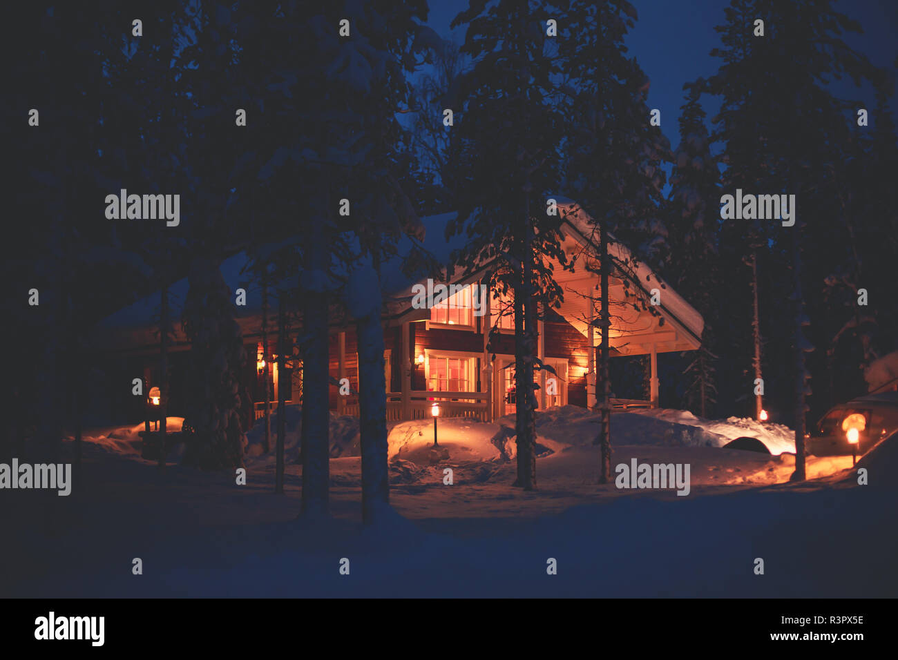 A night view of cozy wooden scandinavian cabin cottage chalet house ...