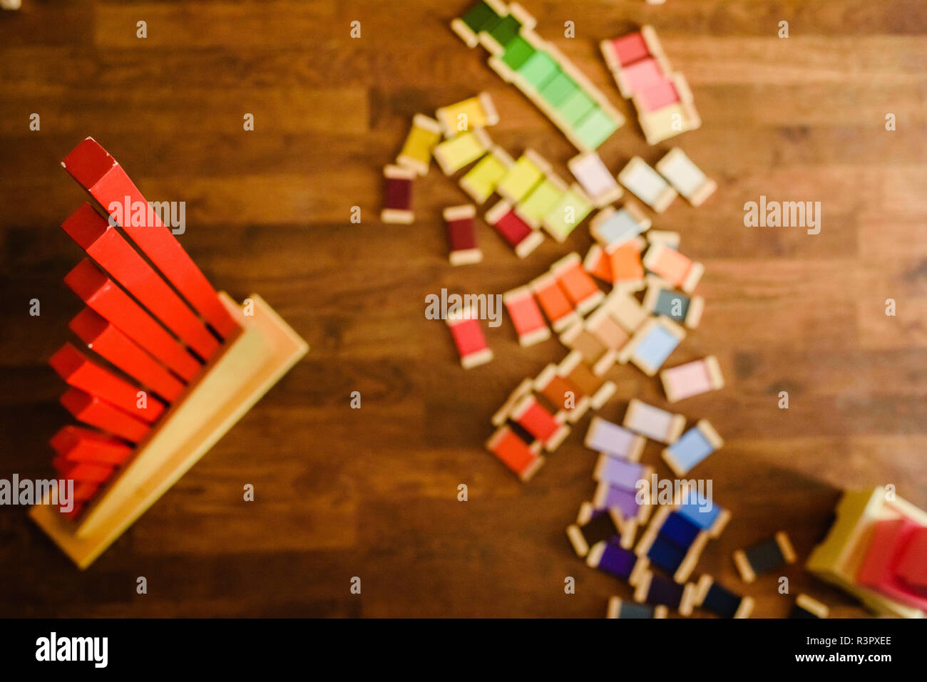 Montessori material with red tower and color charts Stock Photo - Alamy