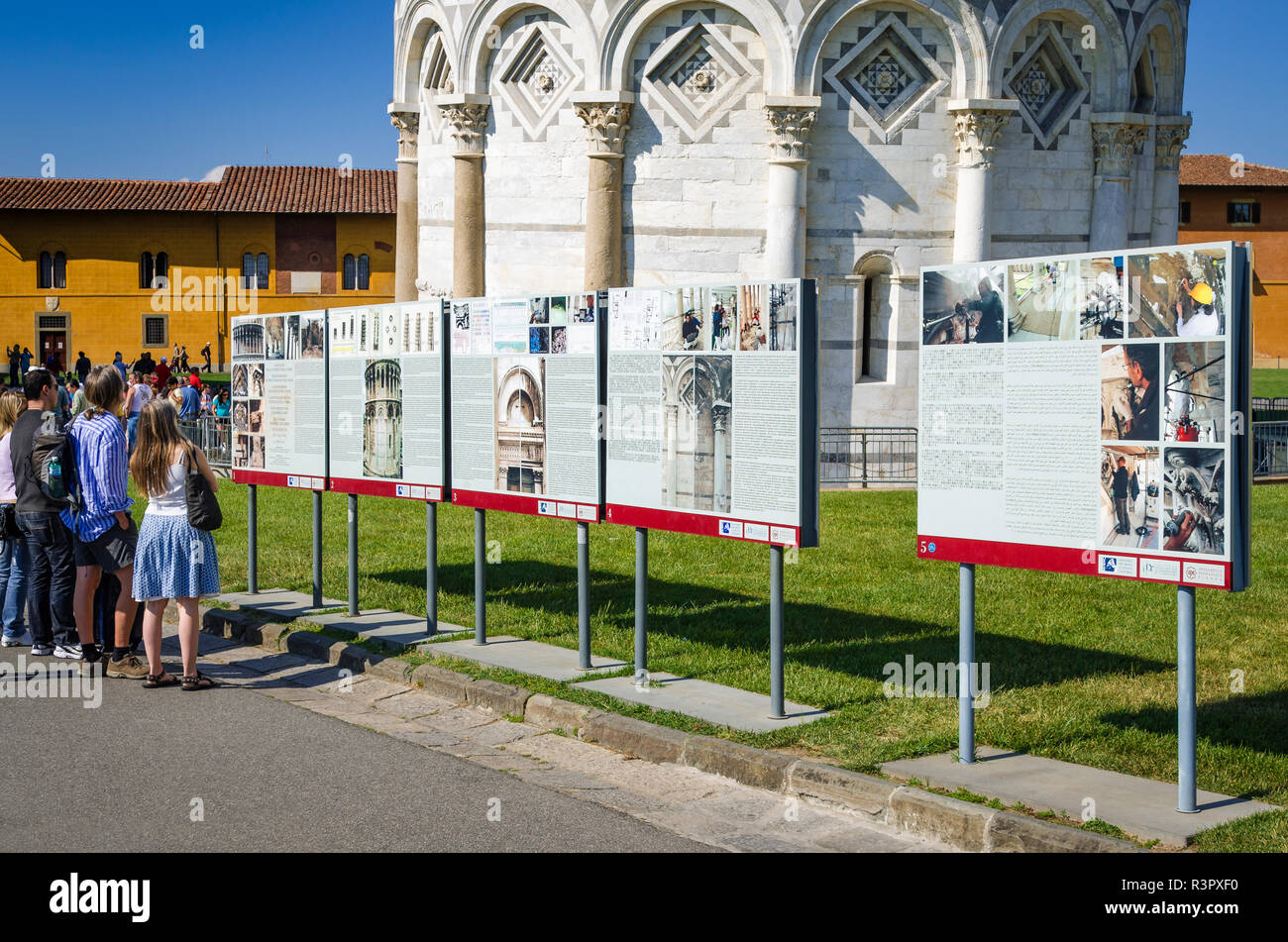 Interpretive signs detailing restoration at the Leaning Tower of Pisa ...