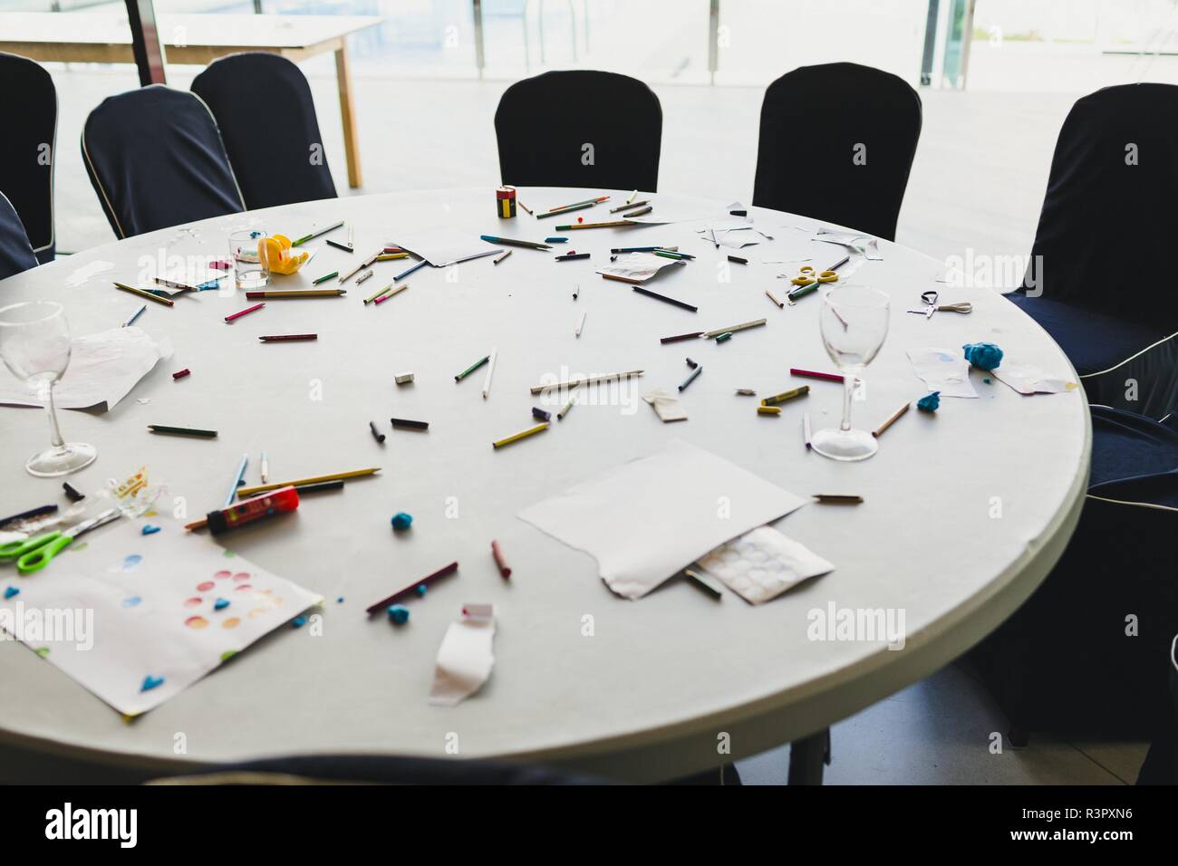 Table with pencils and messy crayons Stock Photo - Alamy