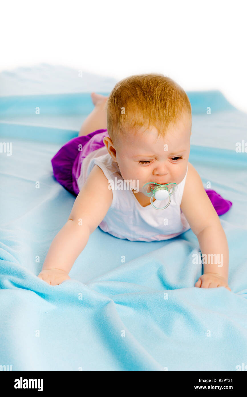 baby girl with a pacifier crying. Studio Stock Photo - Alamy