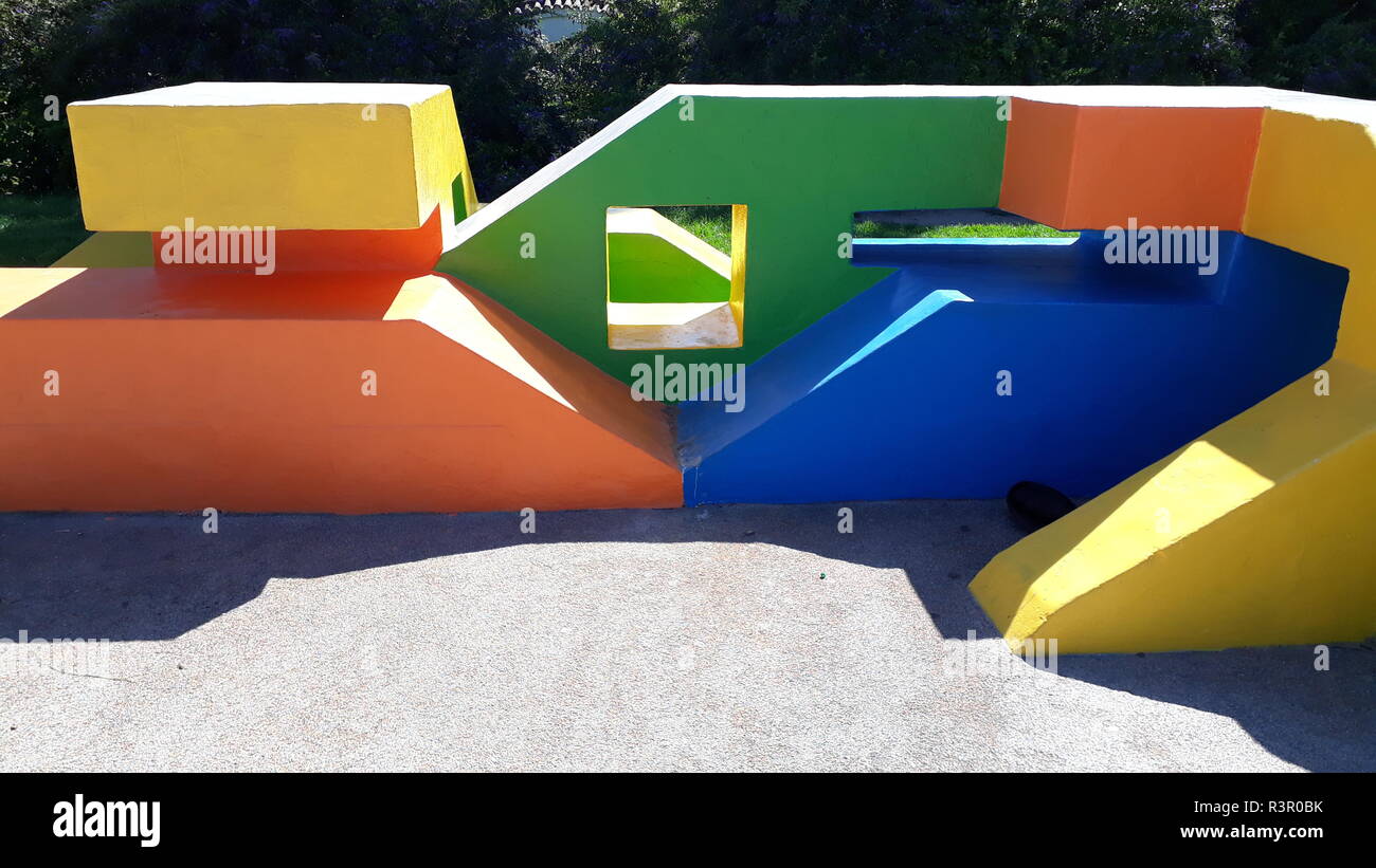 Construction of cement with colorful geometric shapes in a playground ...
