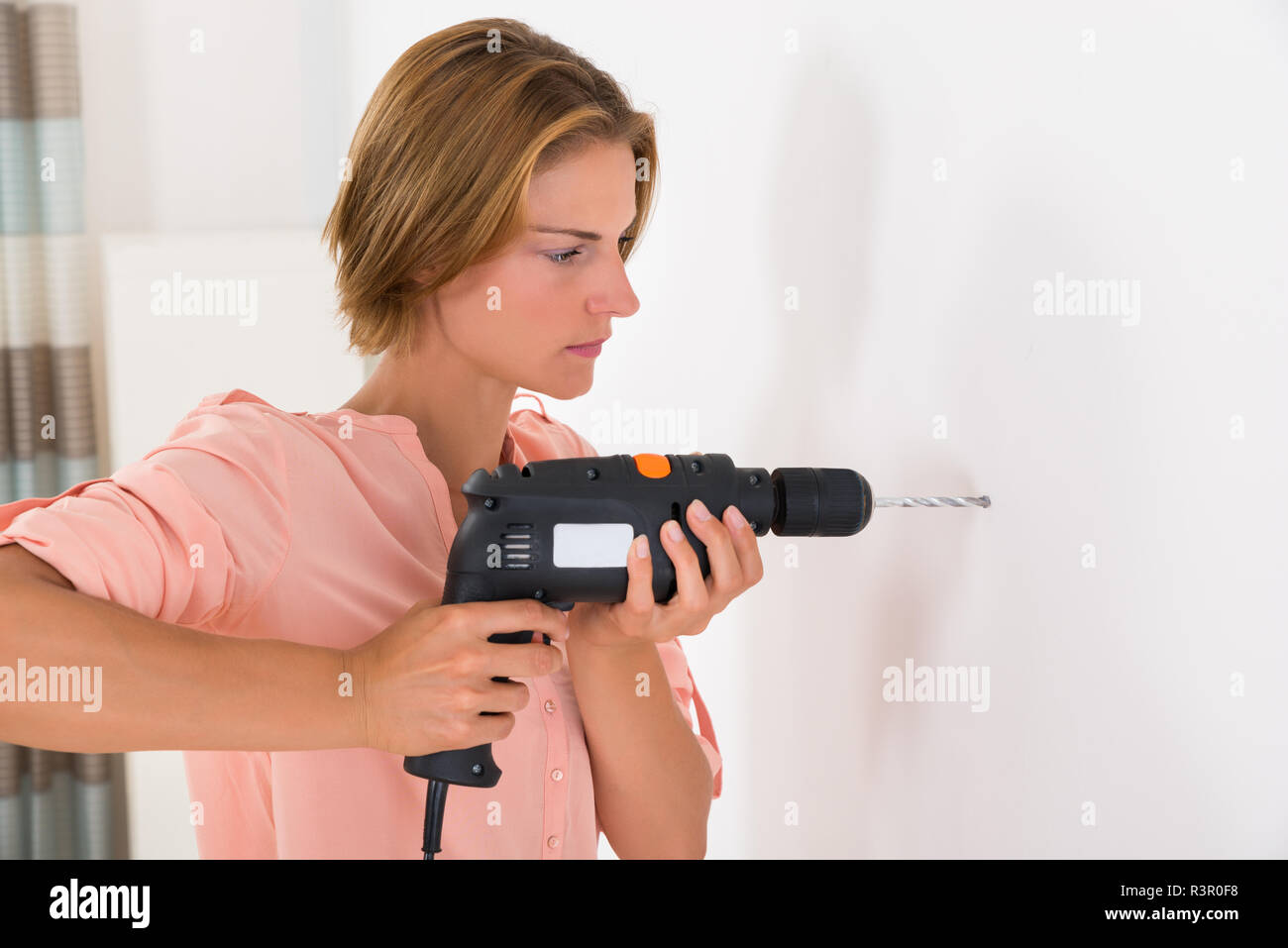 Portrait woman drilling metal hi-res stock photography and images - Alamy