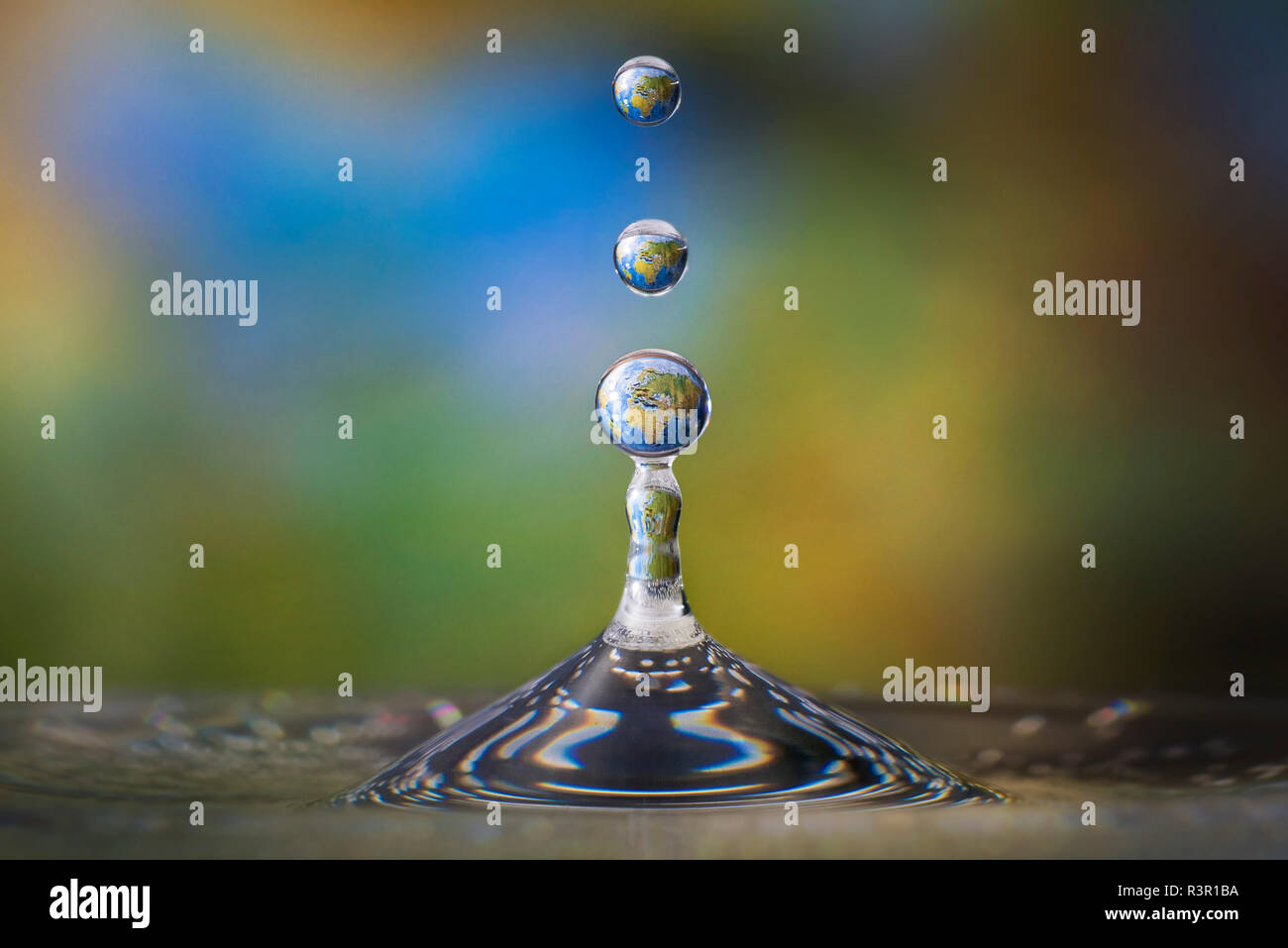 Drops of water with the reflection of the map of the Earth inside them ...