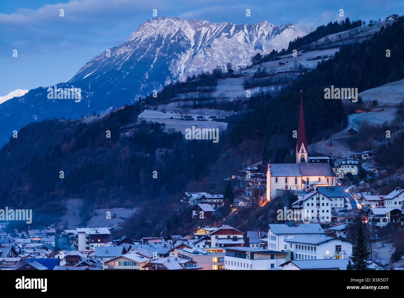 Austria, Tyrol, Otztal, Oetz, town view with church, dawn Stock Photo ...