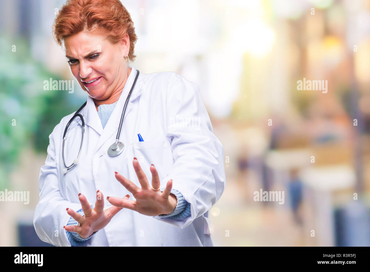 Senior caucasian doctor woman wearing medical uniform over isolated ...