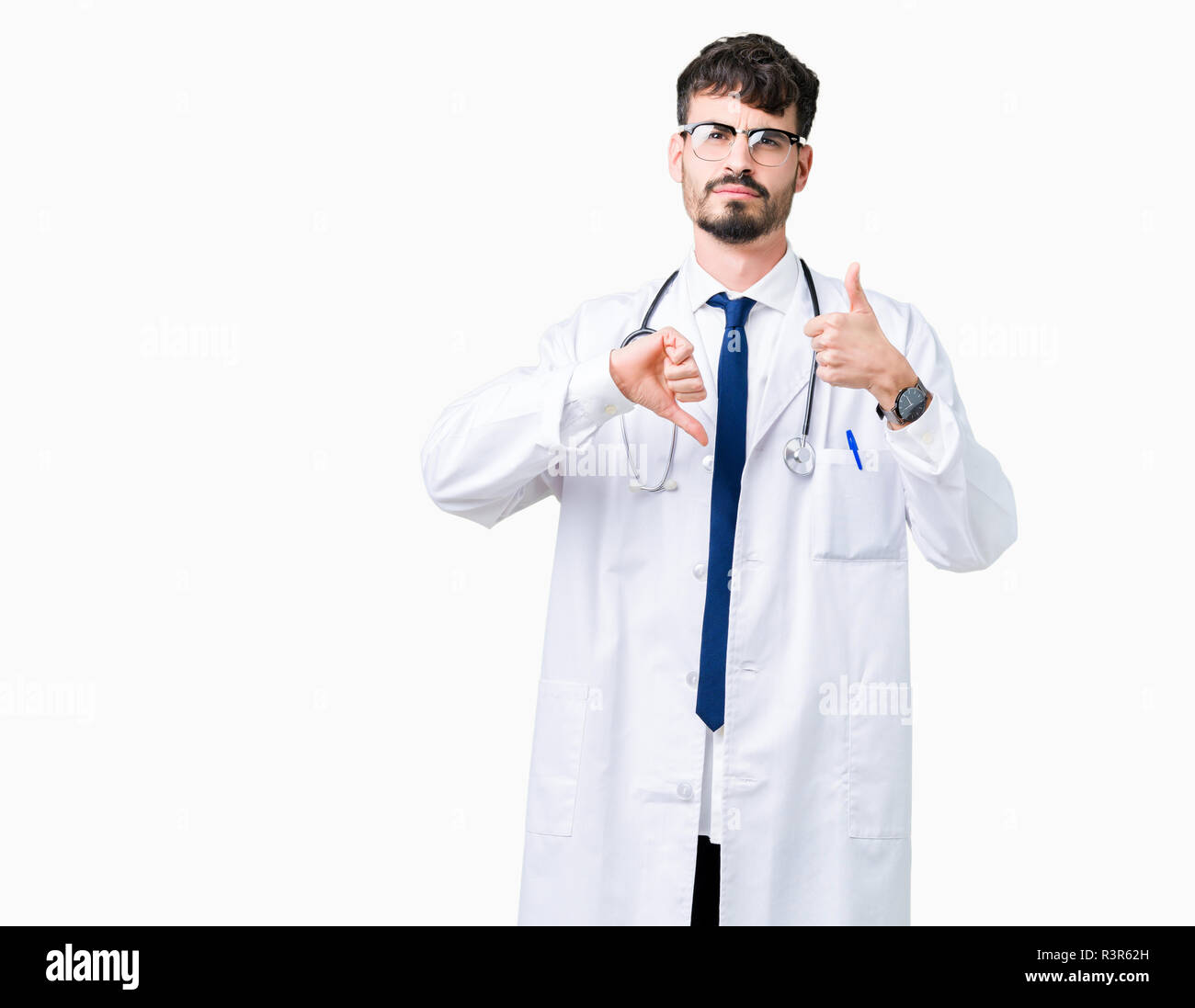 Young doctor man wearing hospital coat over isolated background Doing ...
