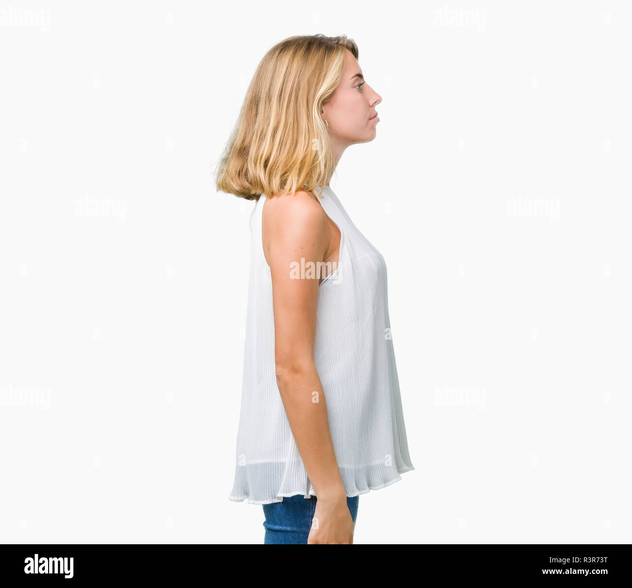 Beautiful young elegant woman over isolated background looking to side ...