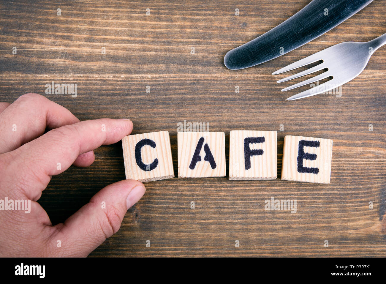 Cafe. Wooden letters on the office desk, informative and communication ...