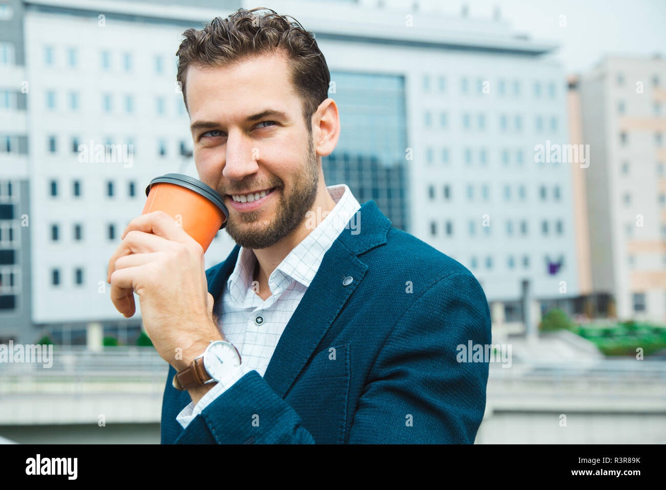 A successful young gentleman with a cup of coffee in his hand Stock ...