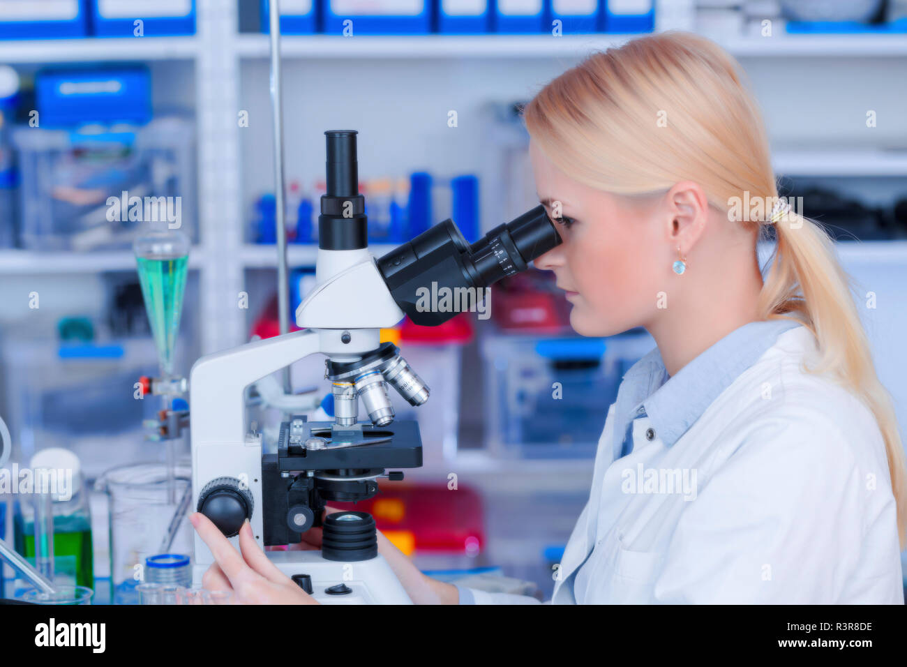 Scientist using microscope Stock Photo - Alamy