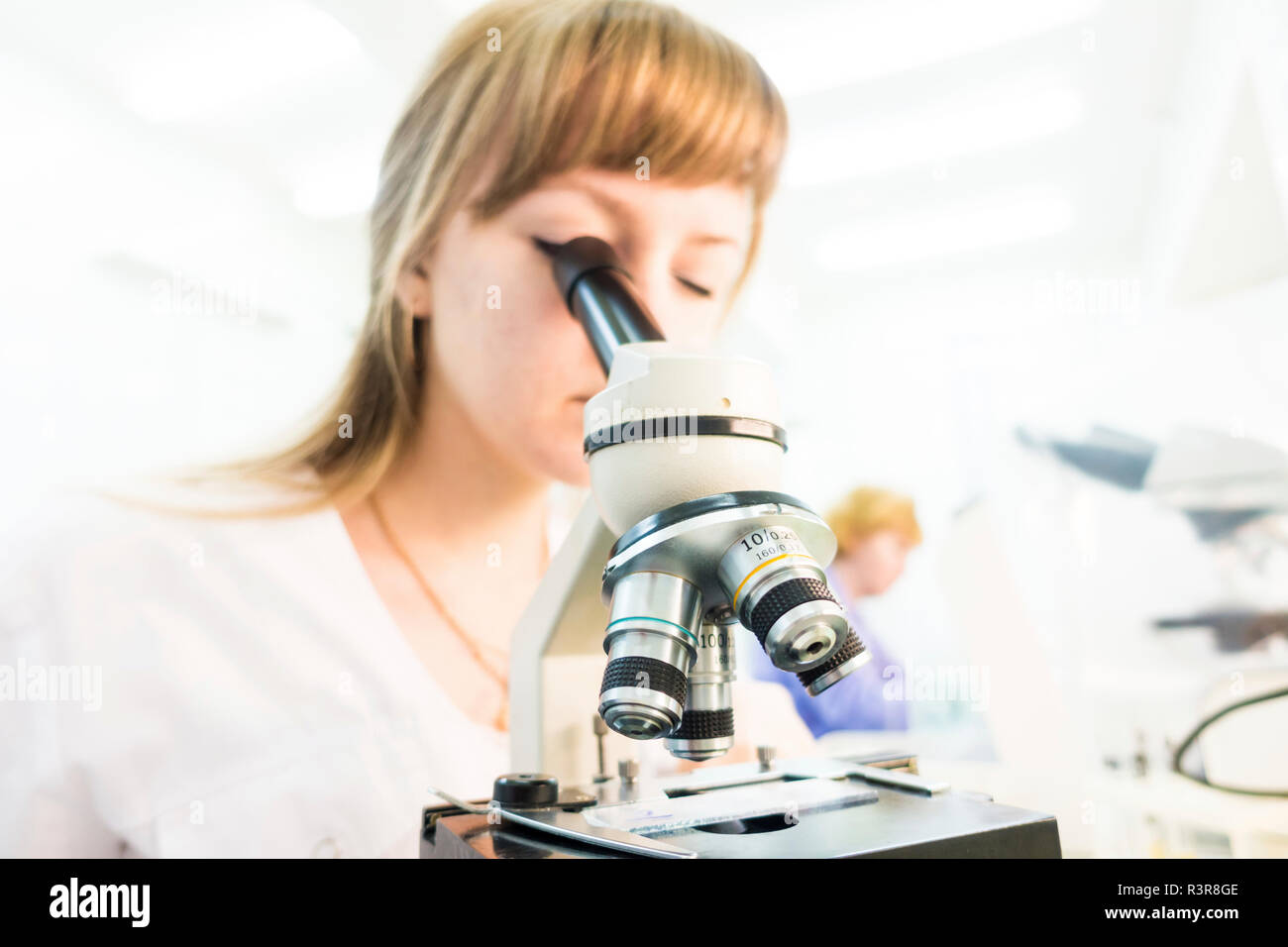 Scientist using microscope Stock Photo - Alamy