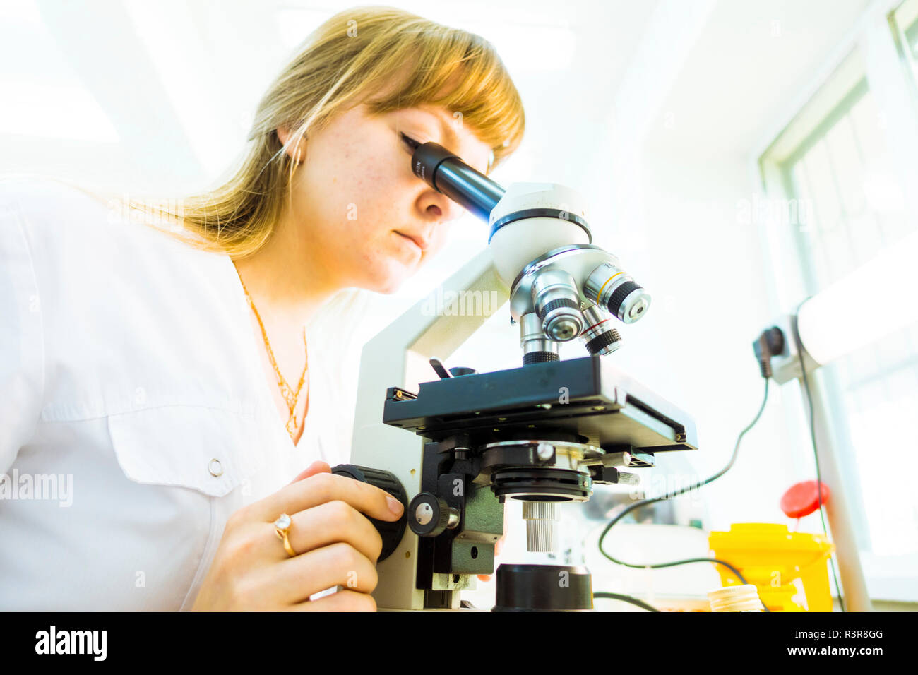 Scientist with microscope hi-res stock photography and images - Alamy