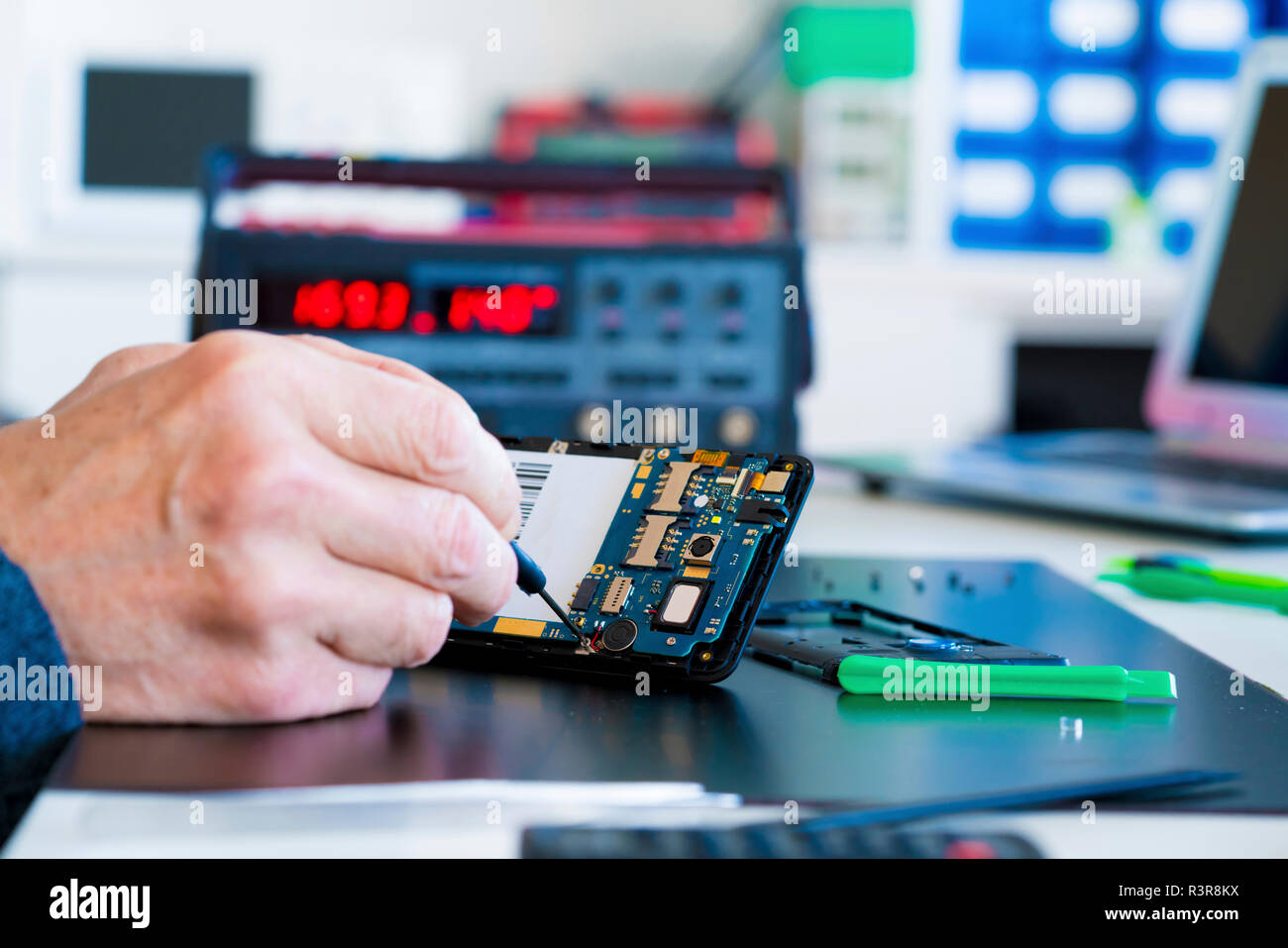 Mobile phone repair Stock Photo - Alamy