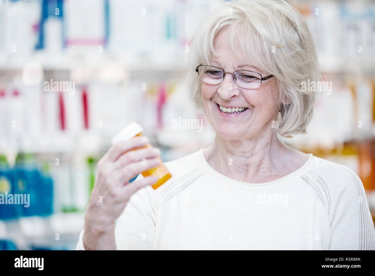 Medicine in senior woman hi-res stock photography and images - Alamy