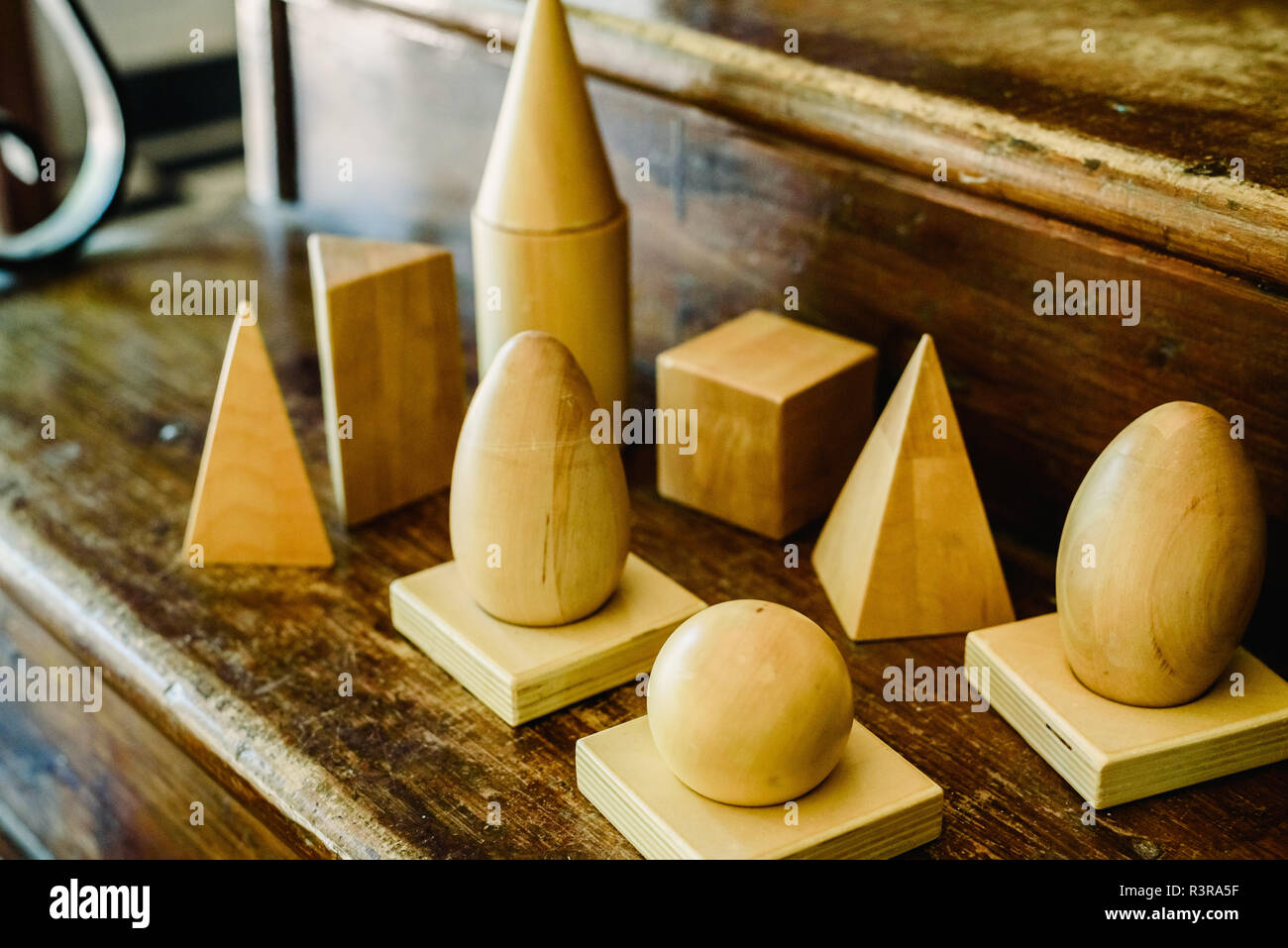 Solid wood shapes to study geometry and volumes, cones, triangles ...