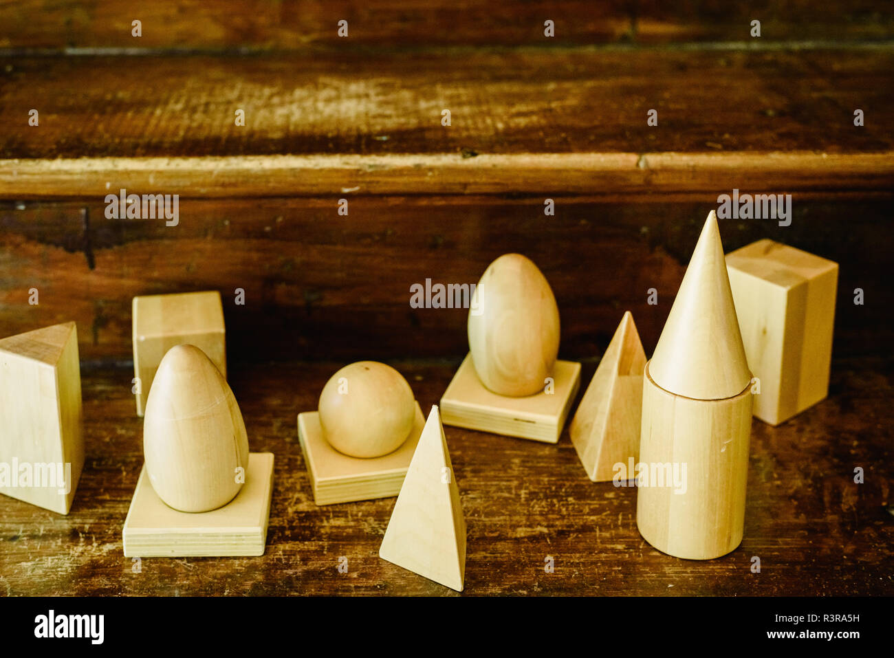 Solid wood shapes to study geometry and volumes, cones, triangles ...