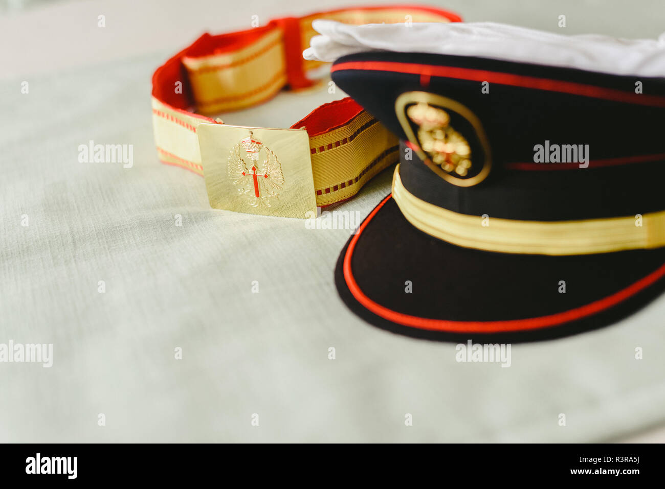 Captain cap and belt of military uniform Stock Photo - Alamy