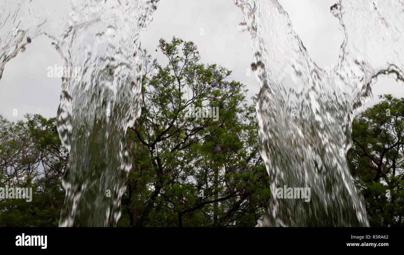 Wide stream of water falling in a semi-translucent park Stock Photo - Alamy