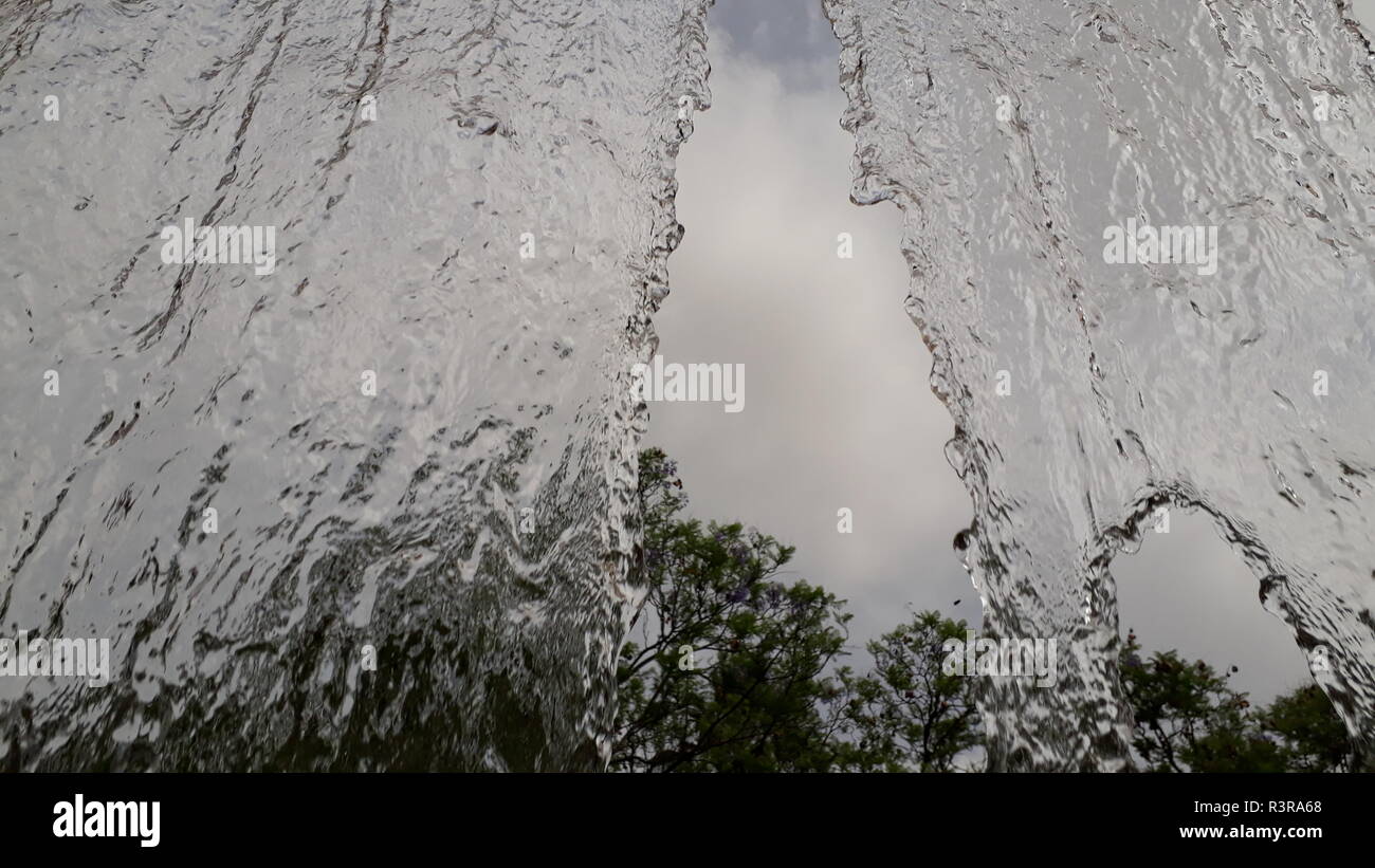 Wide stream of water falling in a semi-translucent park Stock Photo - Alamy