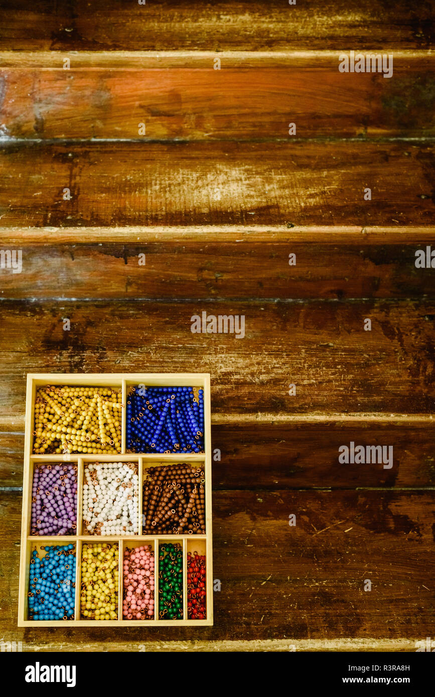 Color bead stairs, counting in a montessori classroom Stock Photo - Alamy