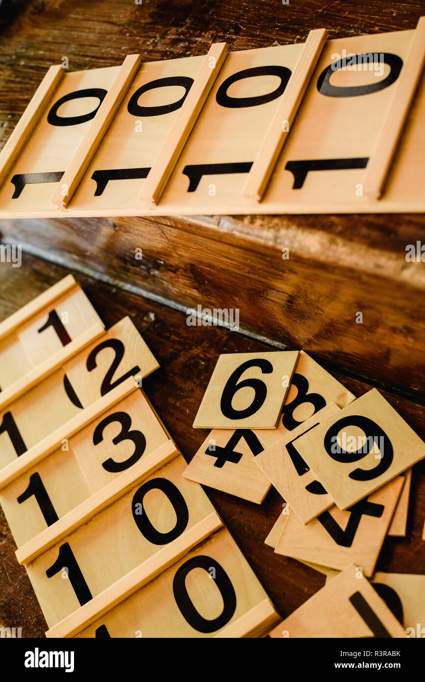 Wooden numbers in tables to learn mathematics in a Montessori classroom ...