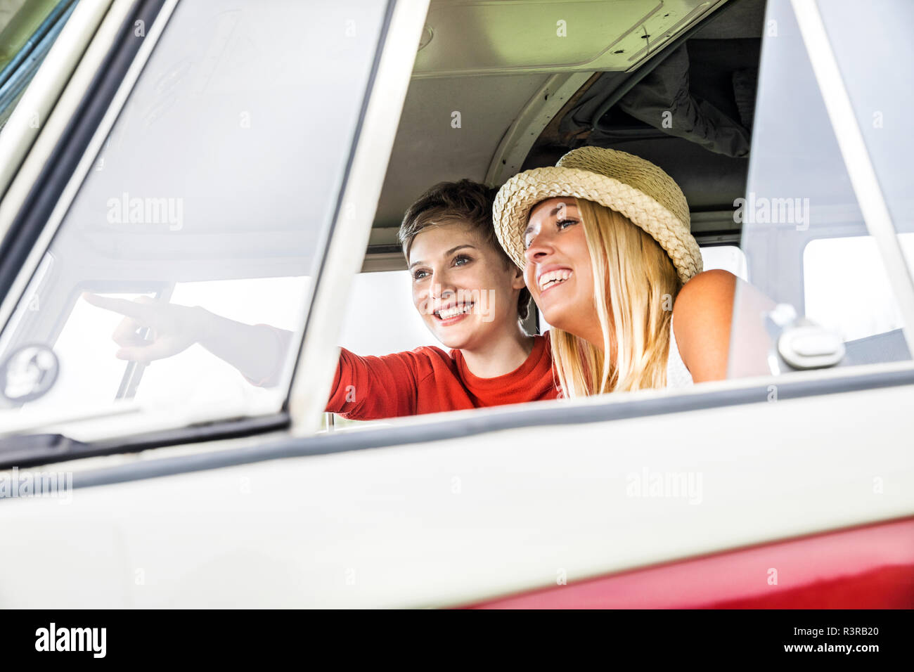 Two happy friends driving hi-res stock photography and images - Alamy