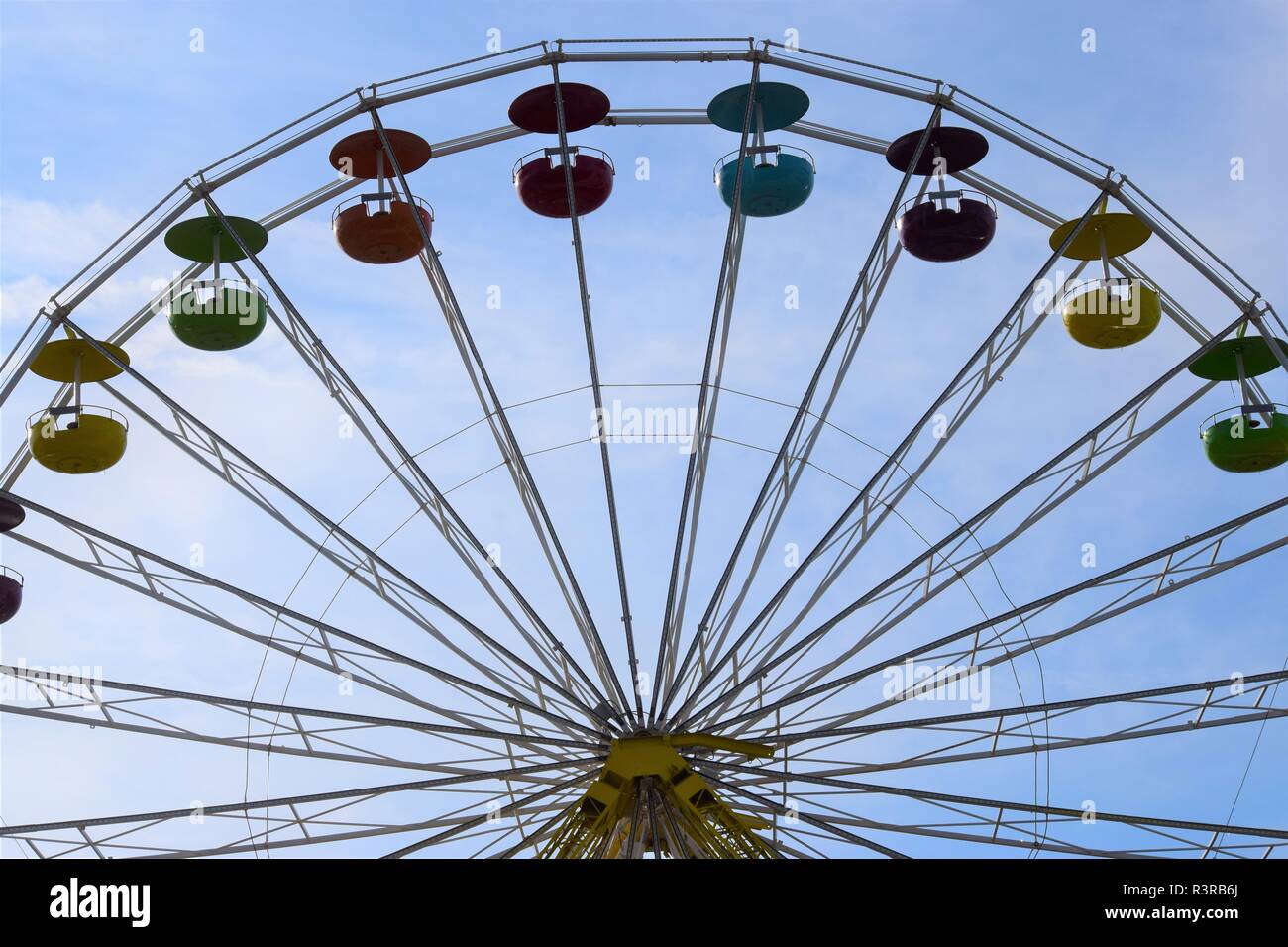 Big Ferris wheel with colorful cars Stock Photo - Alamy