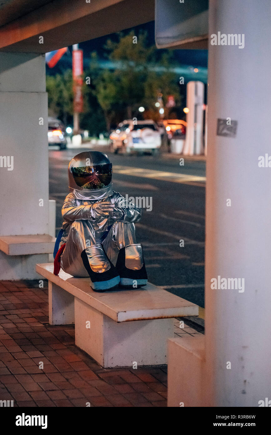 Sitting on bus stop bench hi-res stock photography and images - Alamy