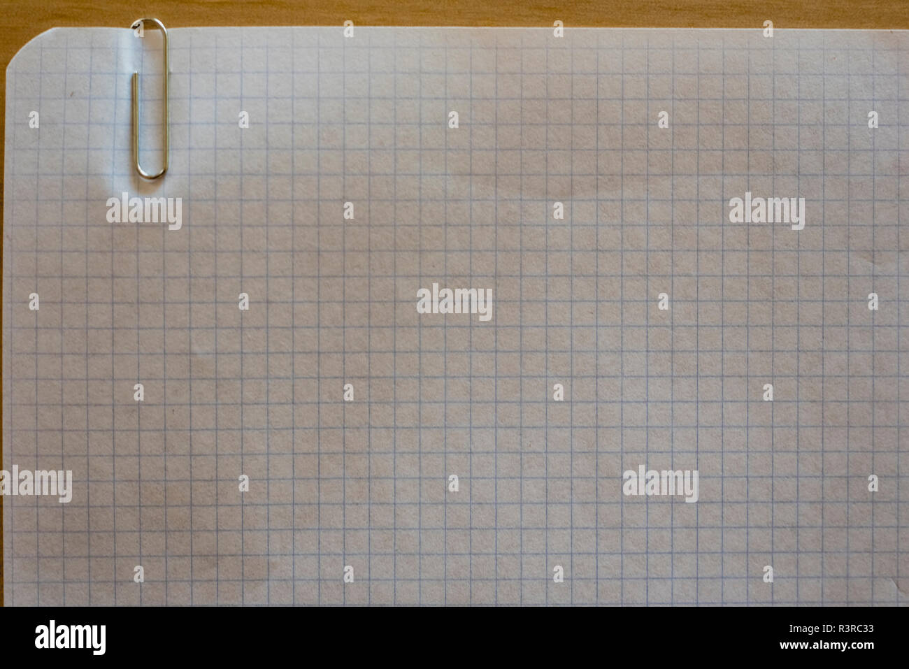 Graph paper with a clip for office work Stock Photo - Alamy