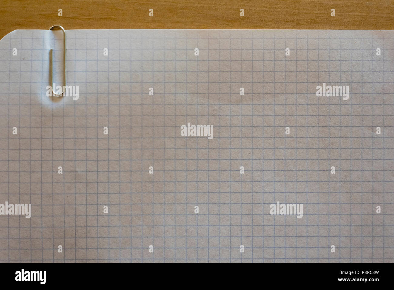 Graph paper with a clip for office work Stock Photo - Alamy