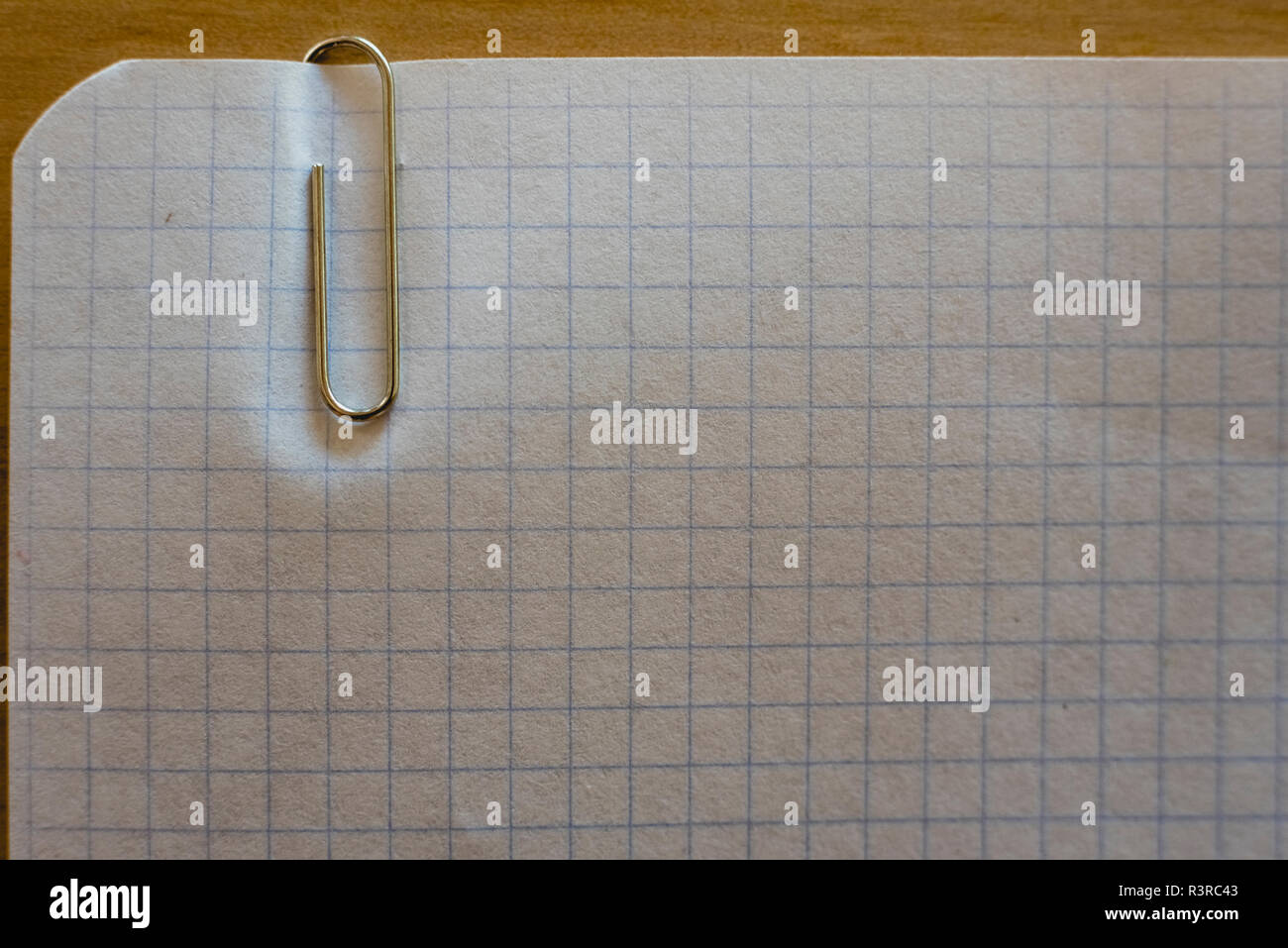Graph paper with a clip for office work Stock Photo - Alamy