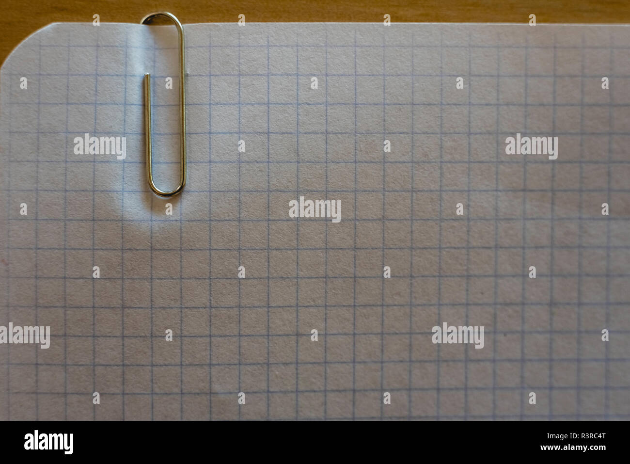 Graph paper with a clip for office work Stock Photo - Alamy