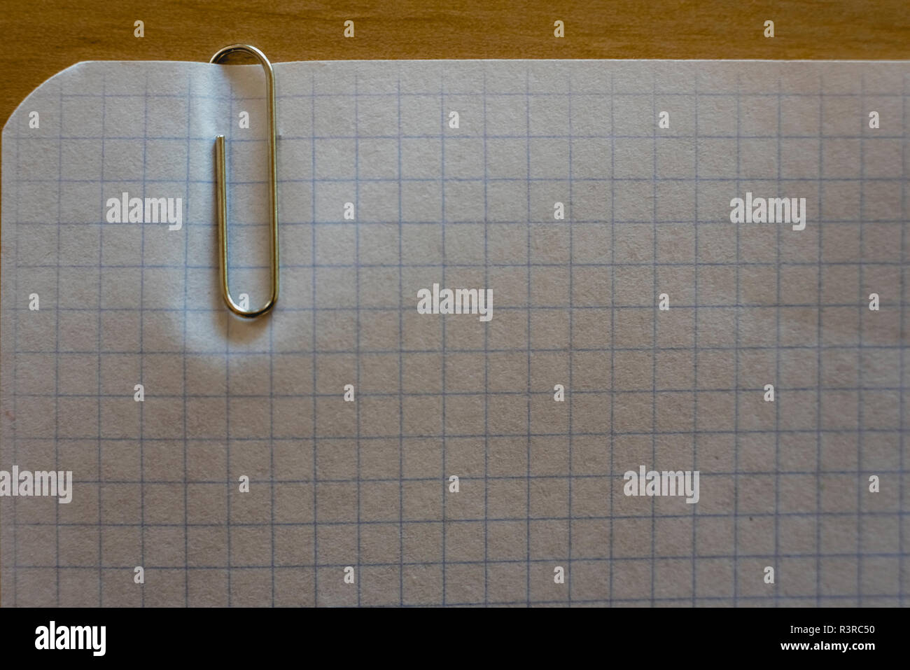 Graph paper with a clip for office work Stock Photo - Alamy