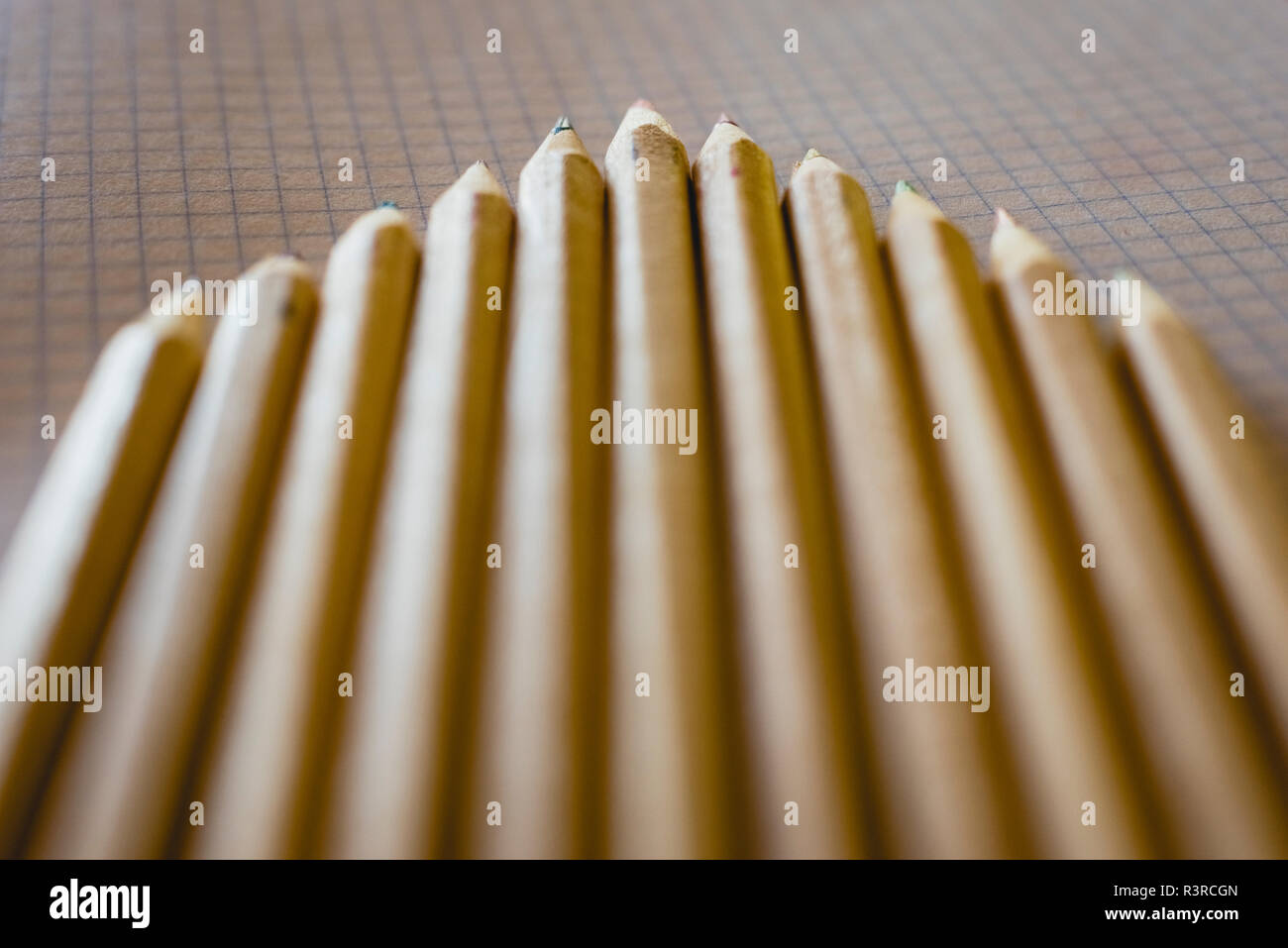 Group of pencils arranged on graph paper Stock Photo - Alamy