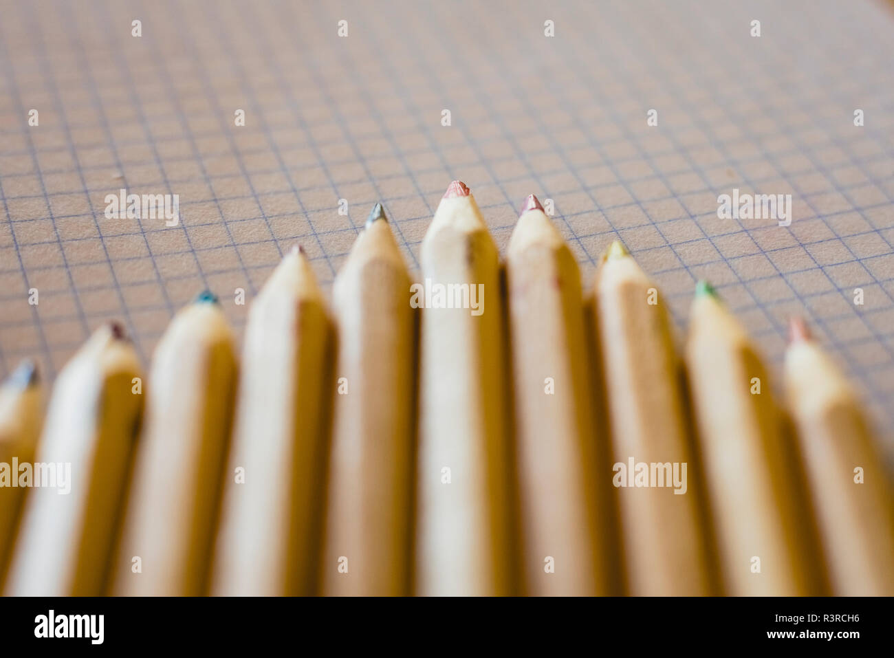 Group of pencils arranged on graph paper Stock Photo - Alamy