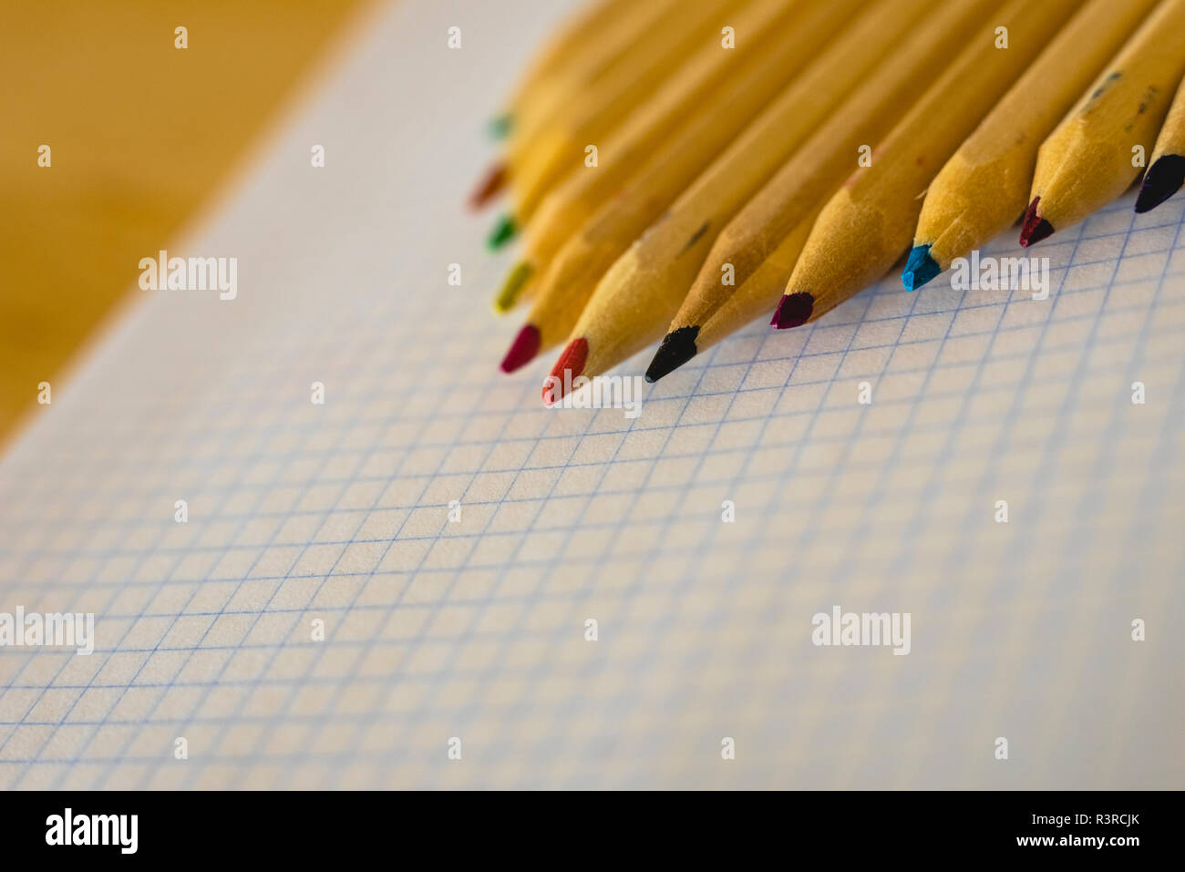Group of pencils arranged on graph paper Stock Photo - Alamy