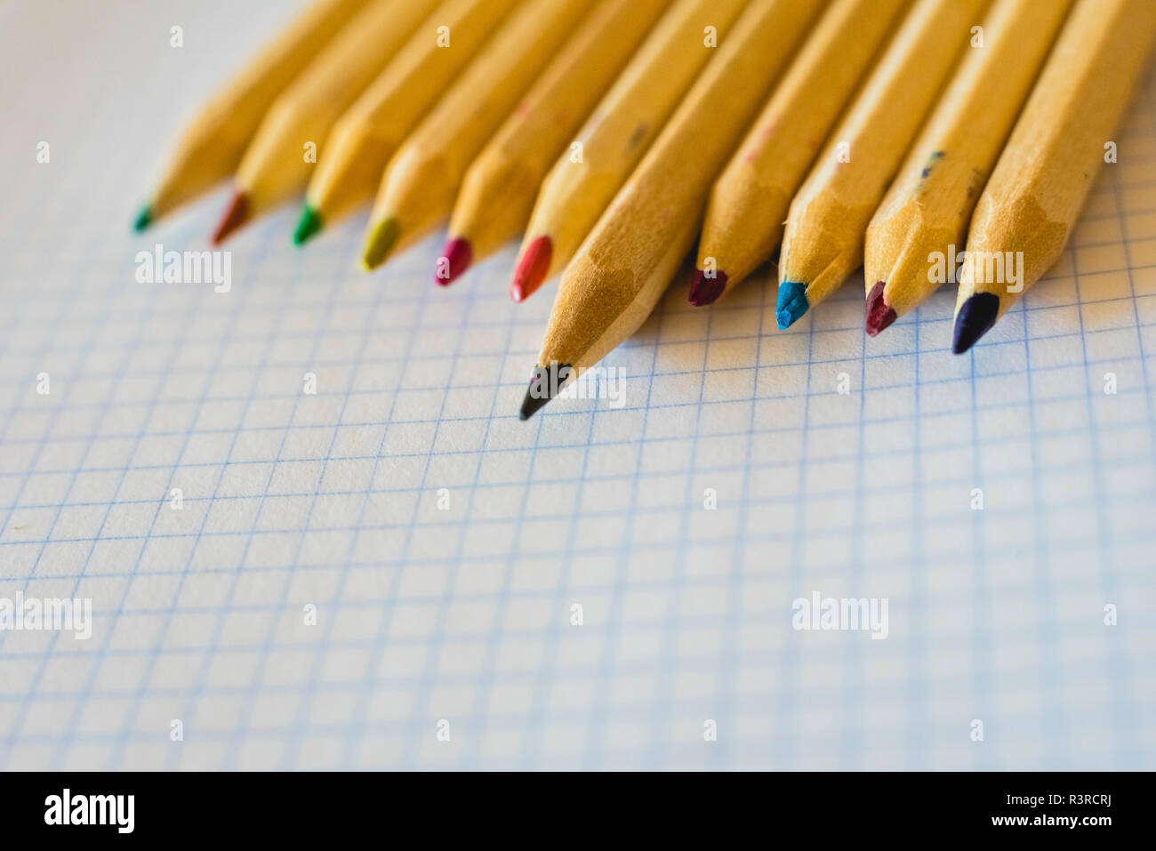 Group of pencils arranged on graph paper Stock Photo - Alamy