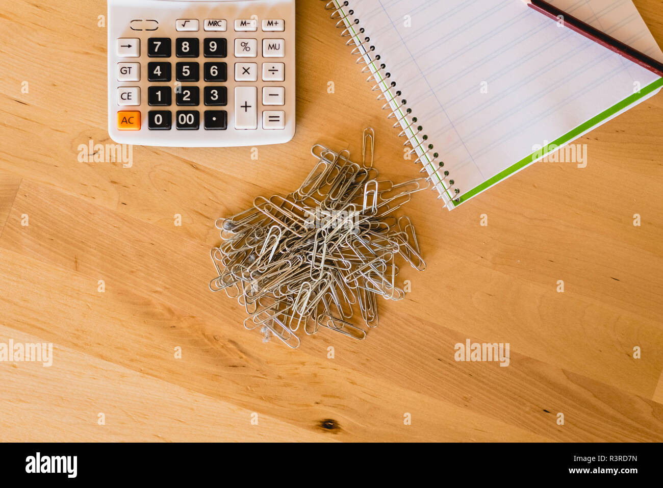 Calculator, paper clips and pencil for finance Stock Photo - Alamy