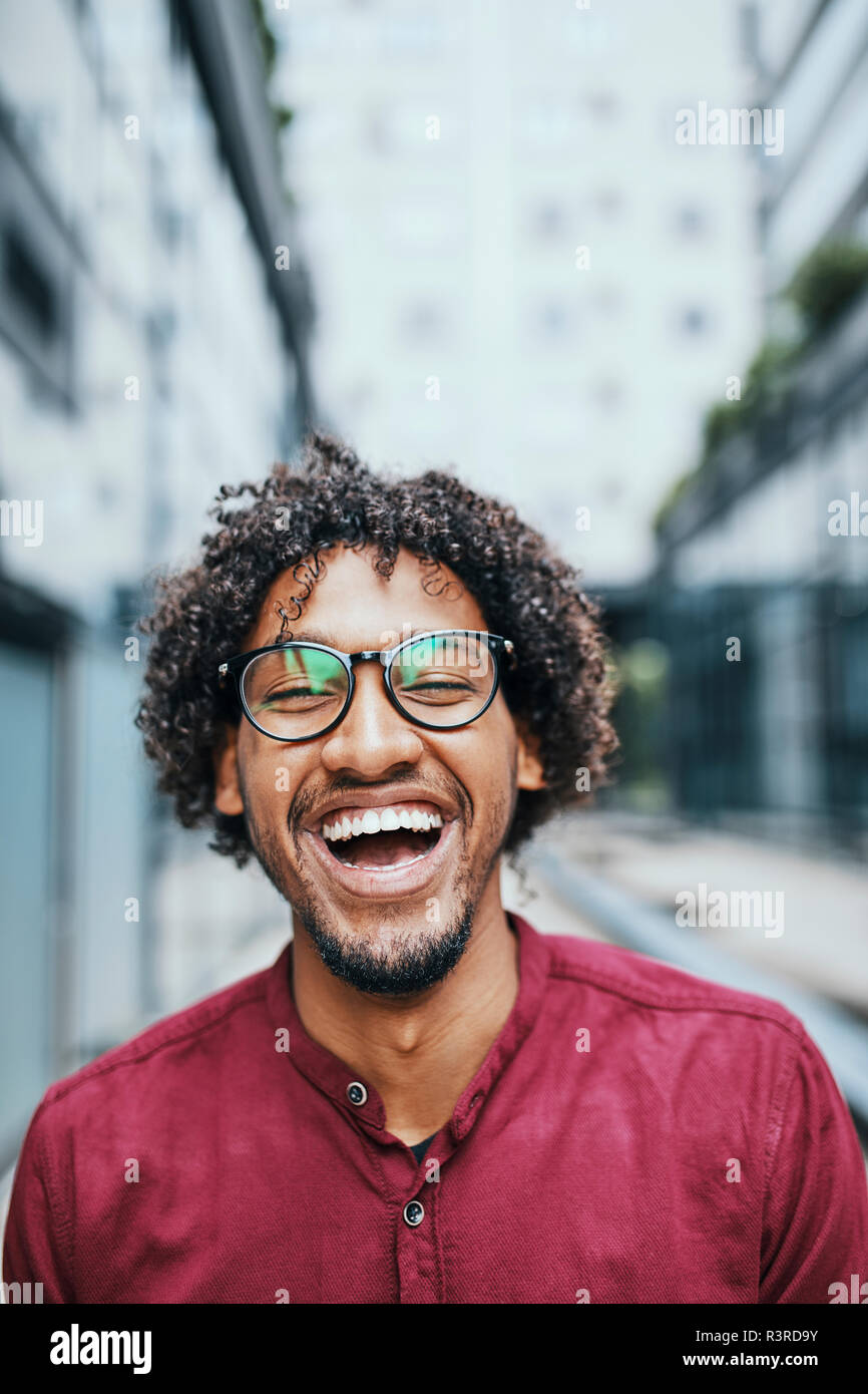 Young man glasses laughing camera hi-res stock photography and images ...