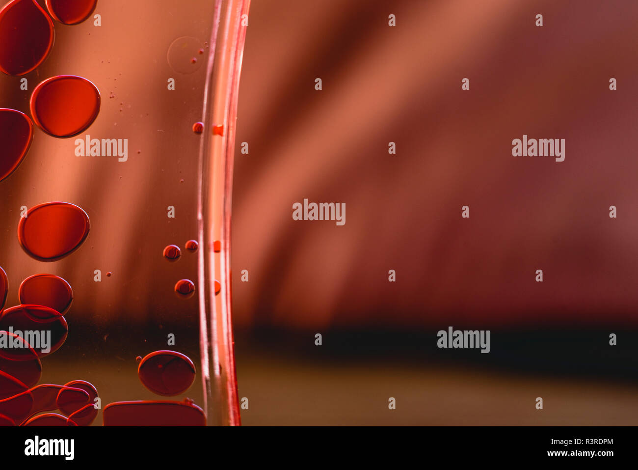 Red drops similar to blood falling in water Stock Photo - Alamy