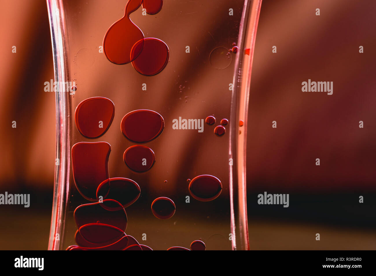 Red drops similar to blood falling in water Stock Photo - Alamy