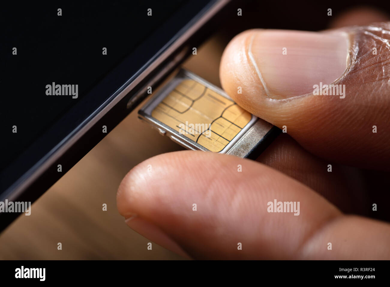 Close-up Of A Person's Hand Inserting Sim Card In Cellphone Stock Photo ...