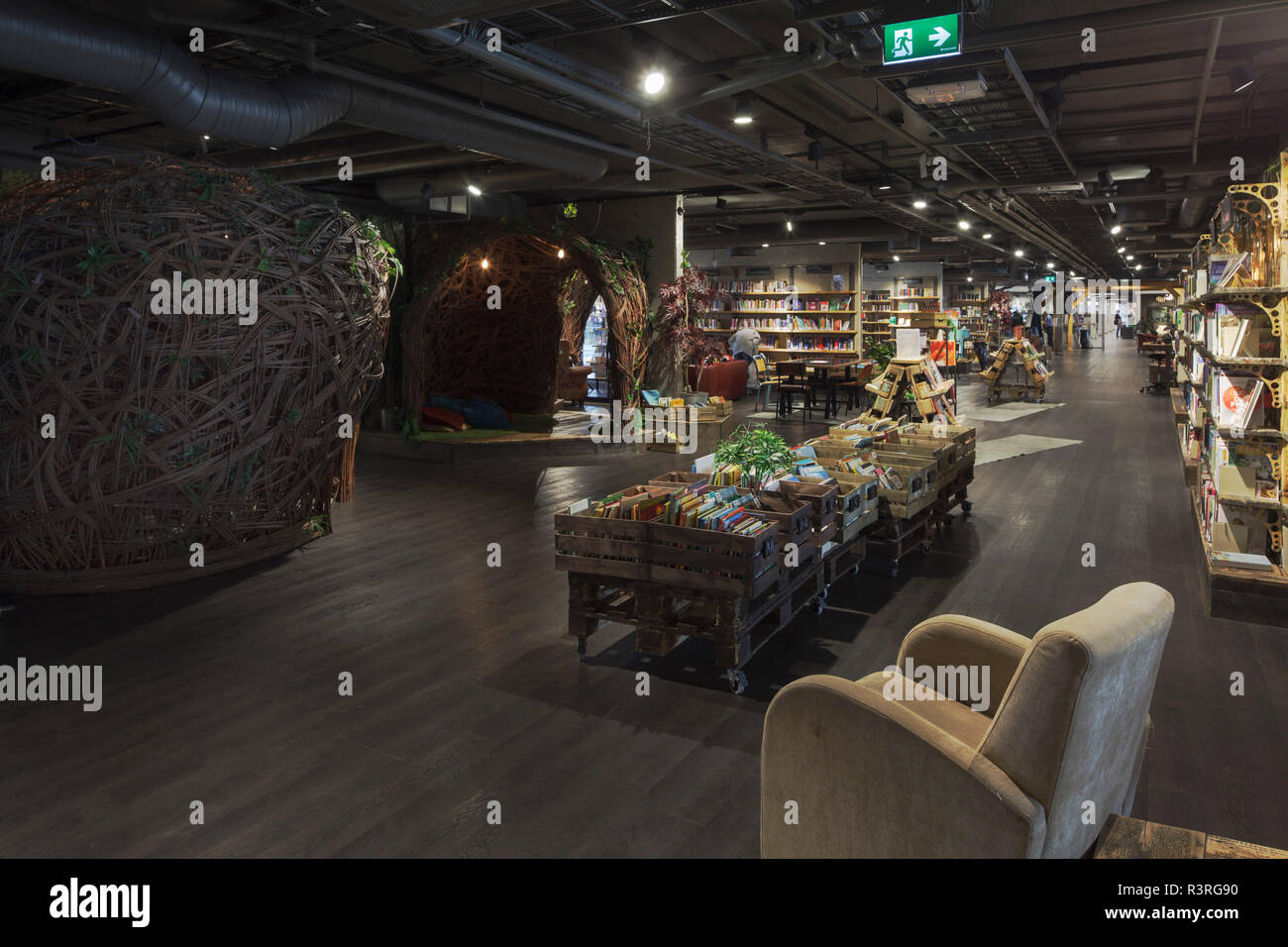 General library view with armchair and birds nest gathering areas ...