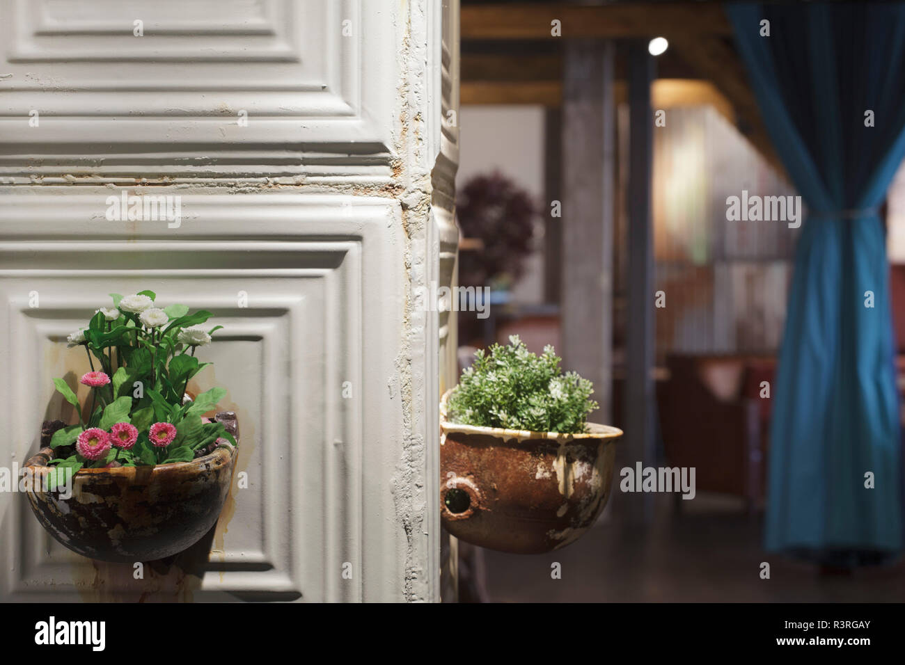 Detail of antique panelled wall and plant holders. Deichman Library ...