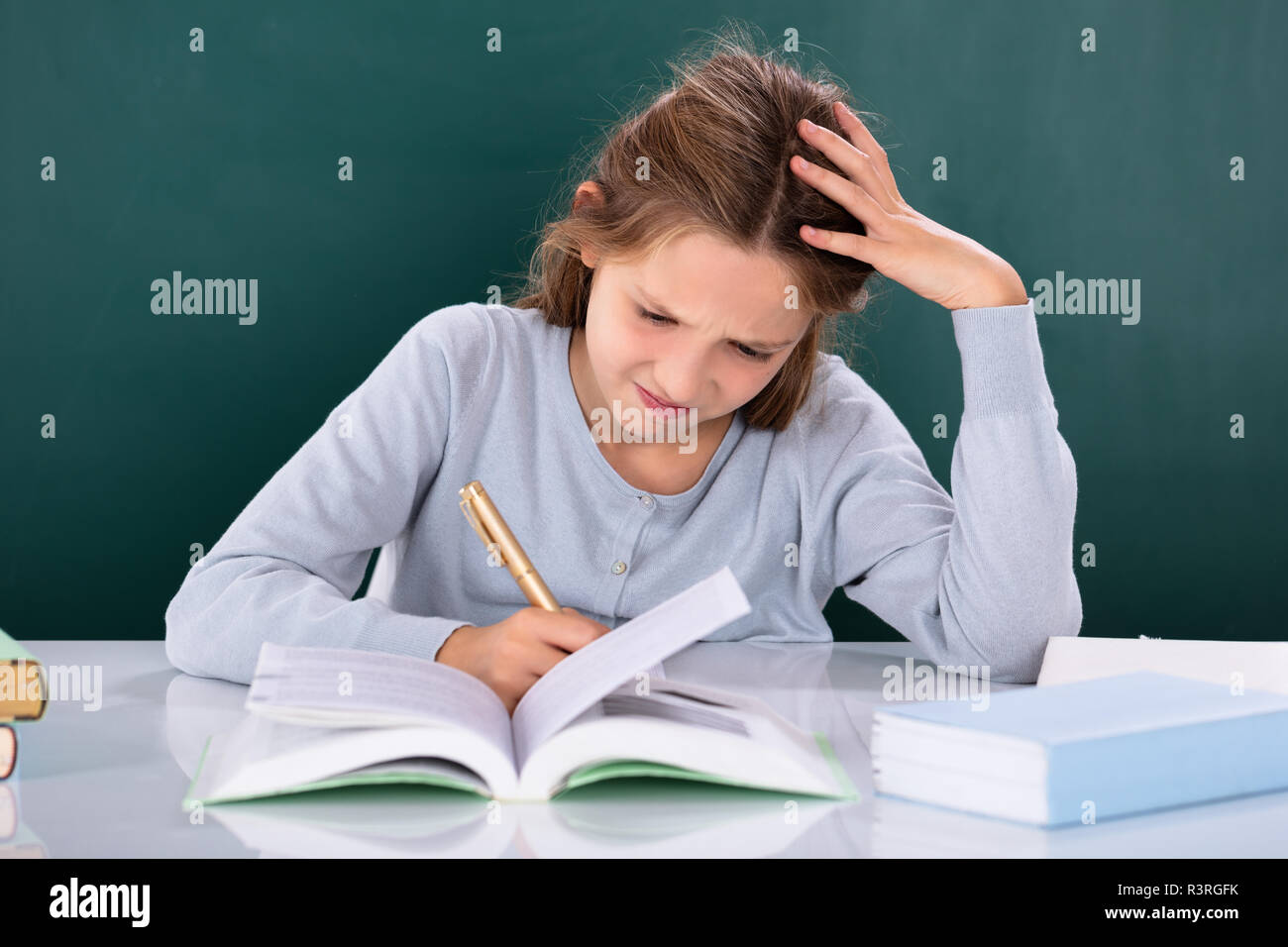 Close-up Of A Depressed Female Student Studying In Classroom Stock ...