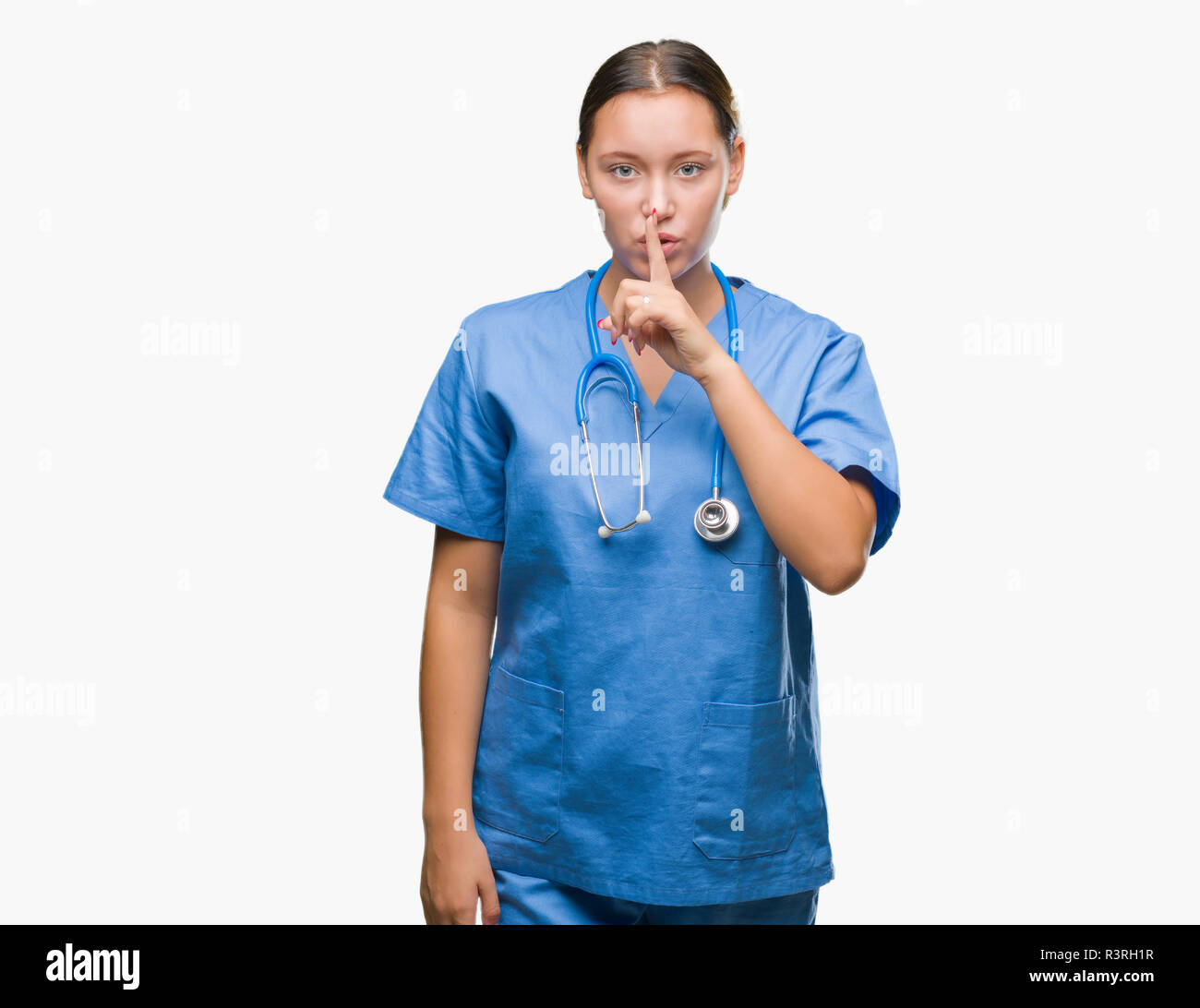 Young caucasian doctor woman wearing medical uniform over isolated ...