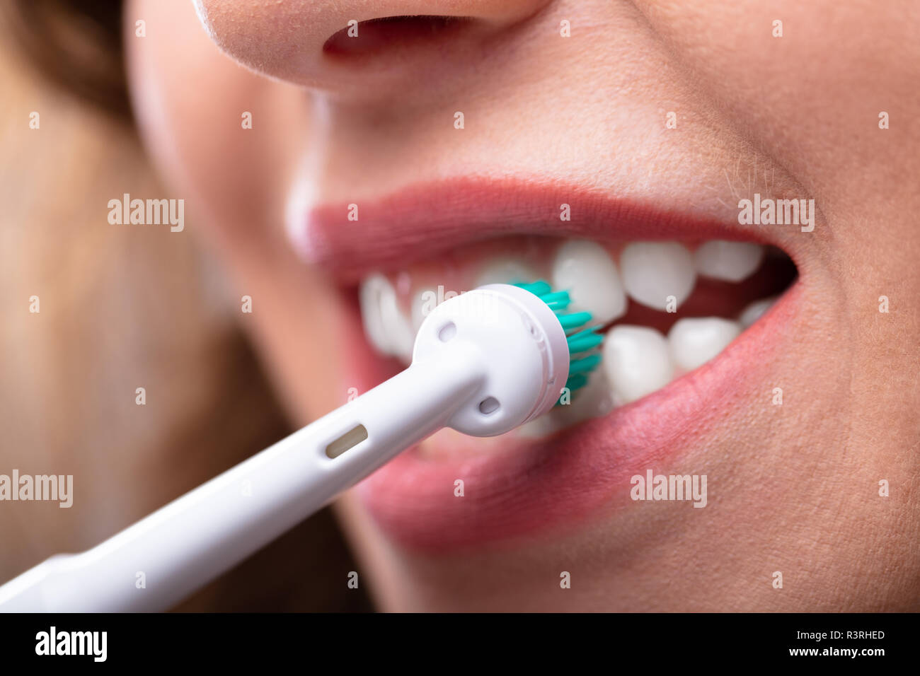 Using an electric toothbrush hi-res stock photography and images - Alamy